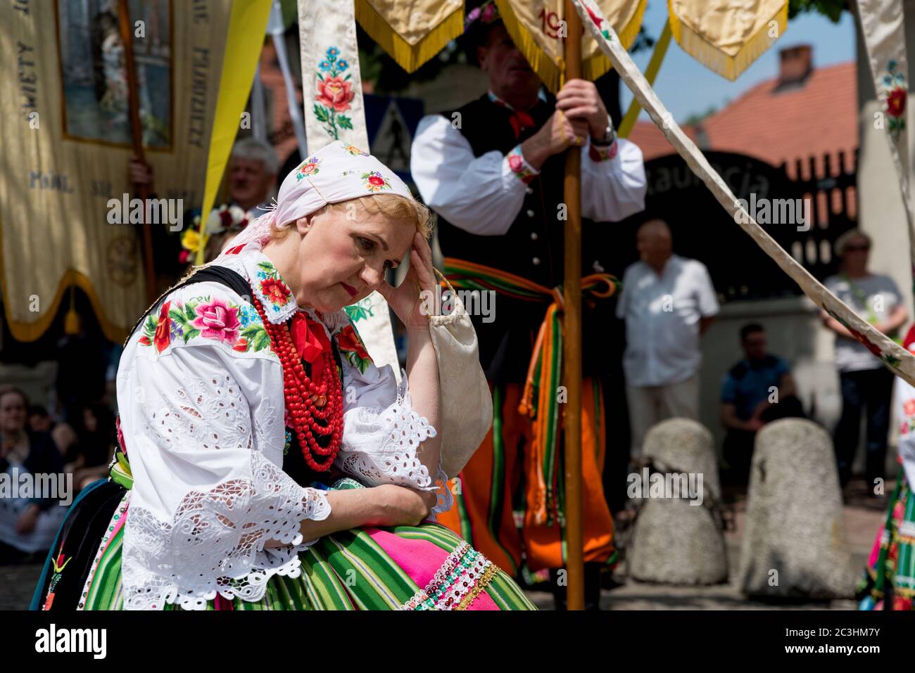 Lowicz, Jun 11, 2020: Woman praying during Corpus Christi procession ...