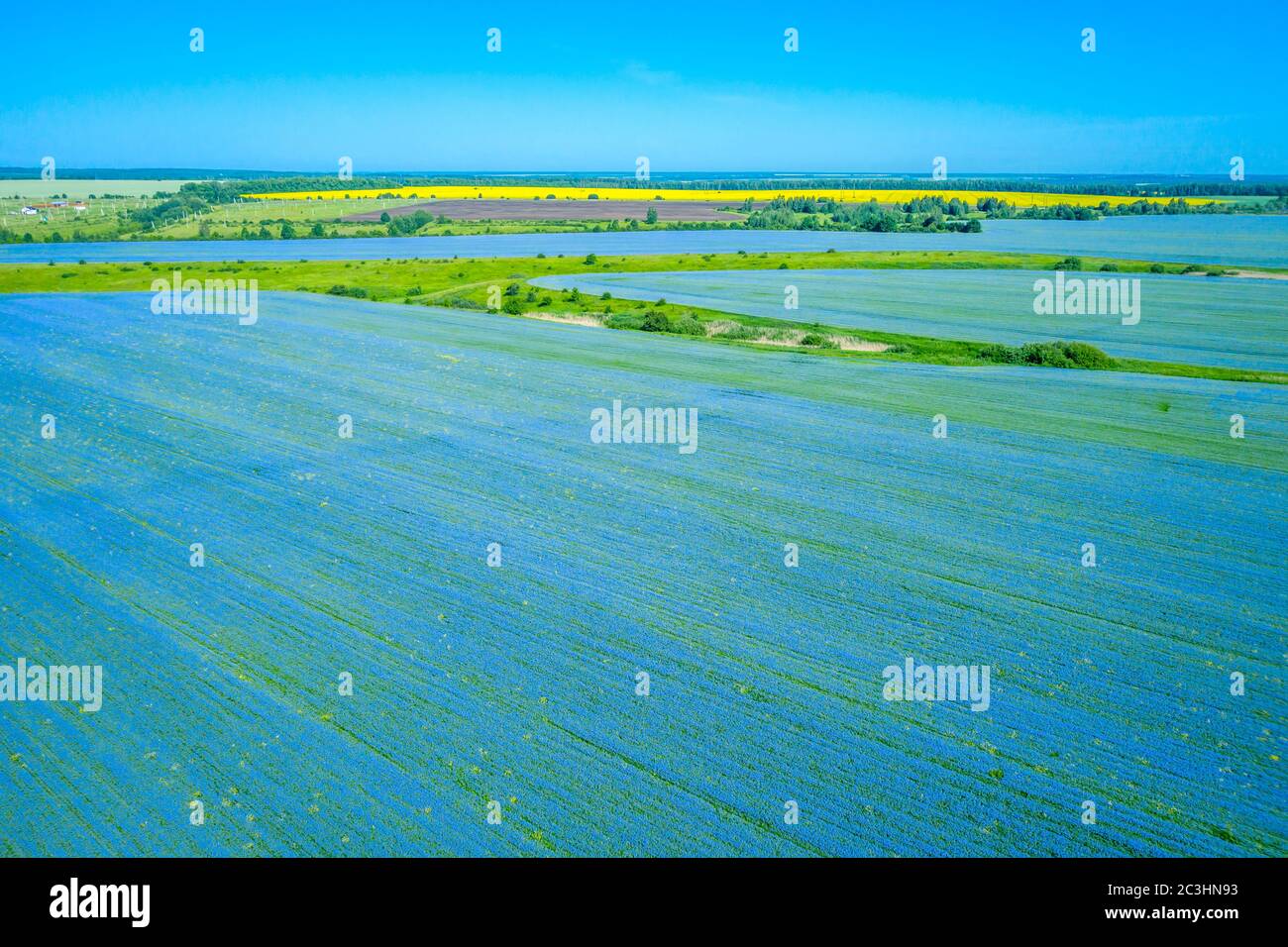 Aerial photos, multi-colored fields of yellow-blooming rapeseed, blue ...