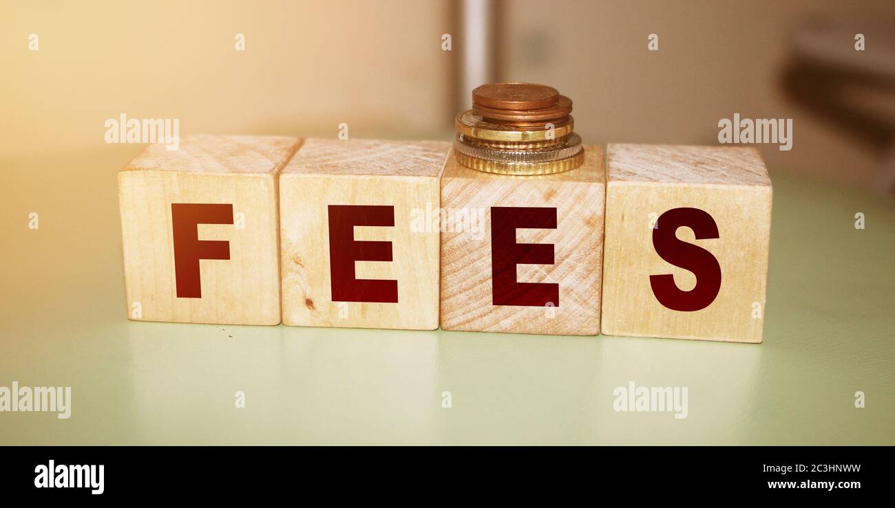 Wooden Blocks with the text: Fees. Taxation and penalties business ...