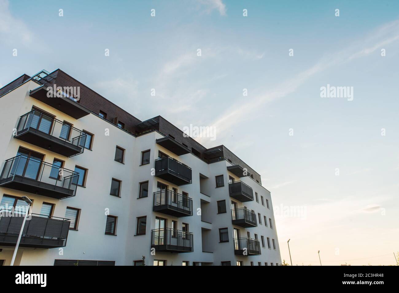 Exterior of modern residential apartment building with balconies blue ...