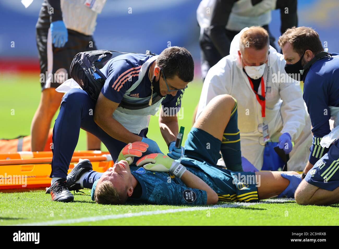 Arsenal goalkeeper Bernd Leno receives treatment for an injury during ...