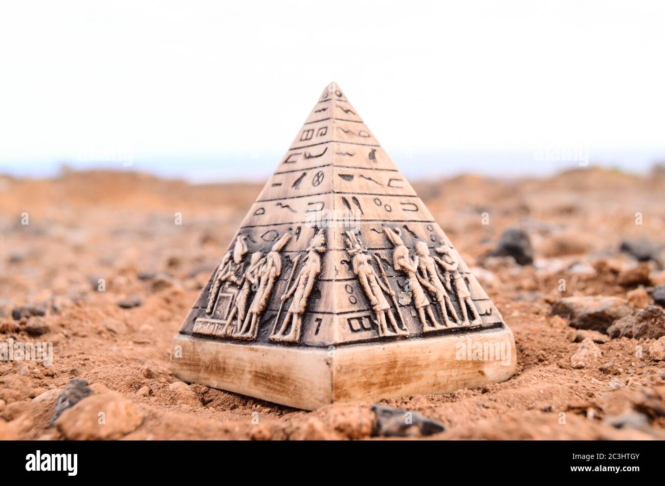 Egyptian Pyramid Model Miniature in the Rock Desert Stock Photo - Alamy