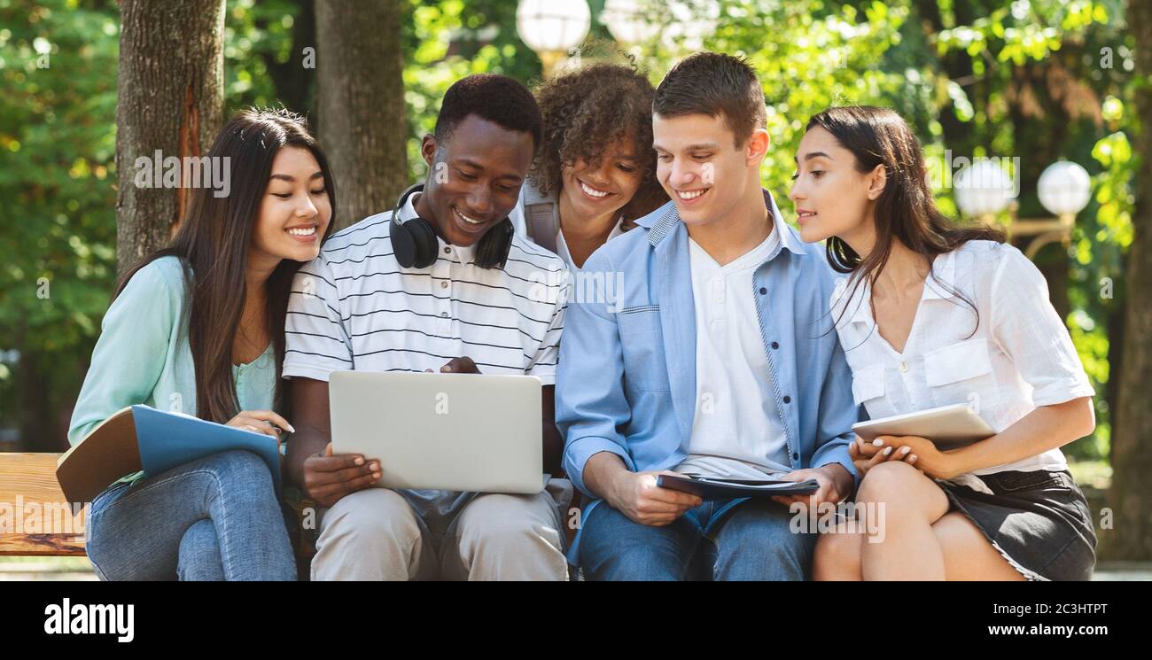 List Of Accepted Students. Happy Interracial Teen Friends Using Laptop ...