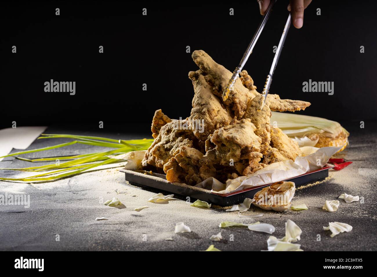 Shot of a person grabbing some chicken legs - perfect for background ...