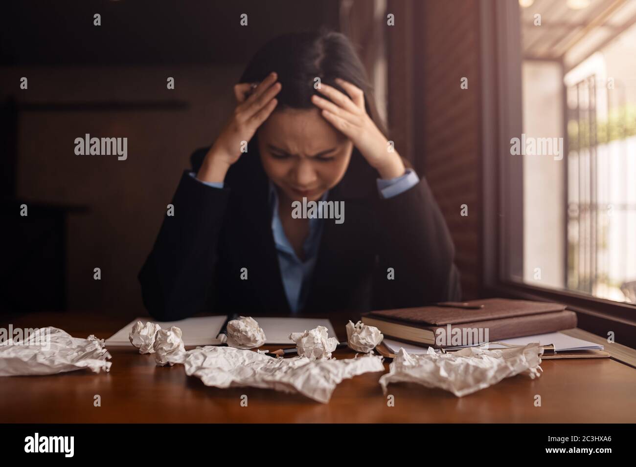 Person thinking crumpled papers hi-res stock photography and images - Alamy