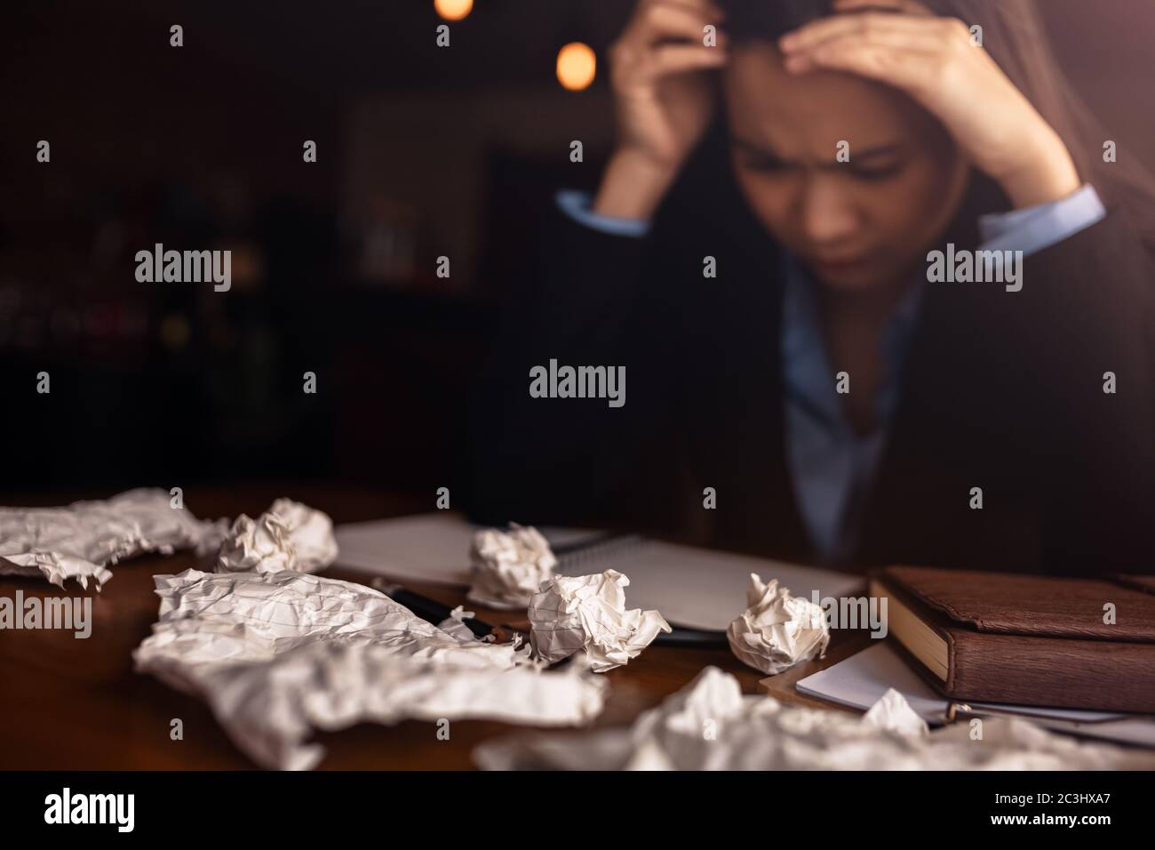 Person thinking crumpled papers hi-res stock photography and images - Alamy