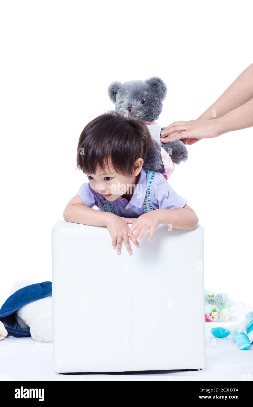 women catch the doll on the kid and playing together Stock Photo - Alamy