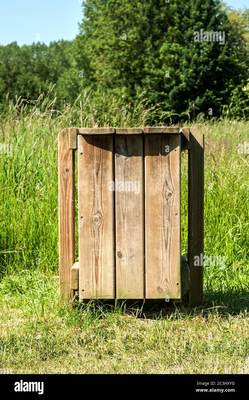 outdoors recycled wood garbage container in a public green area Stock ...