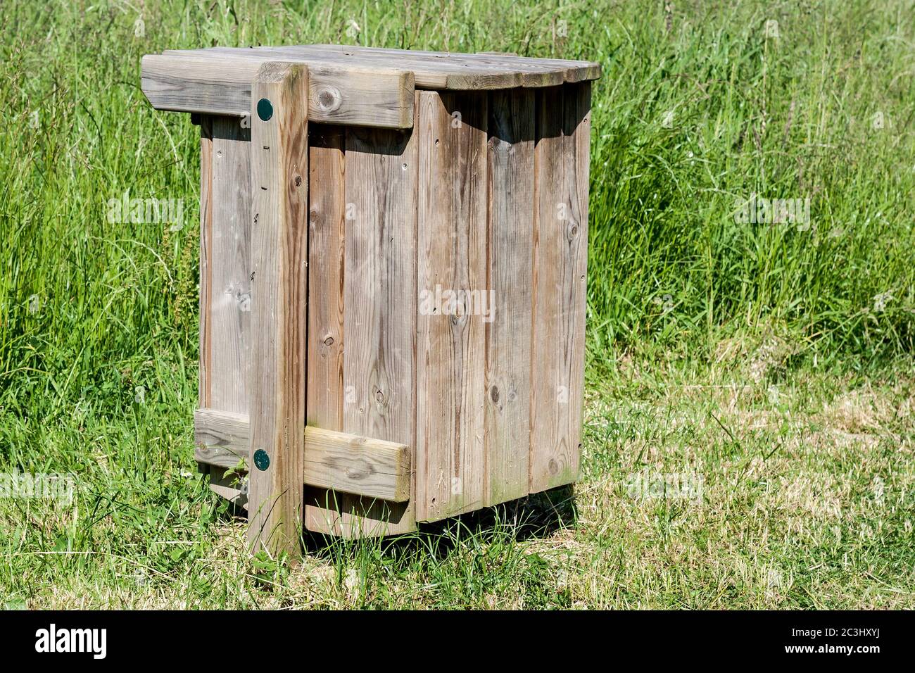 outdoors recycled wood garbage container in a public green area Stock ...