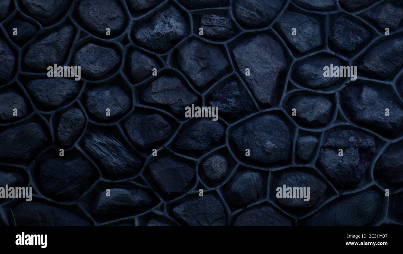 Dark blue wall made of stone and cement. Mosaic of rocks used as tiles ...