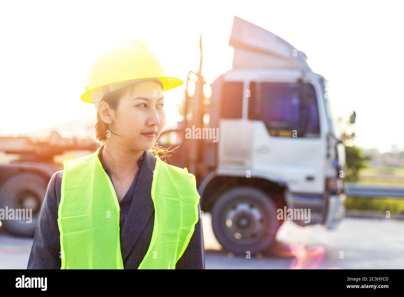 Asian woman engineer check for control loading Containers box from ...