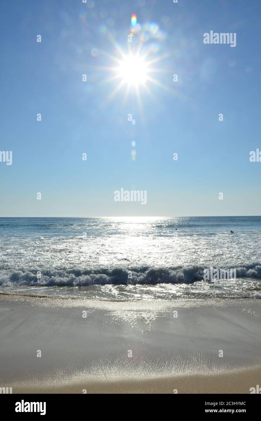 Sun reflection on the beach. Geger Beach is located in Sawangan, about ...