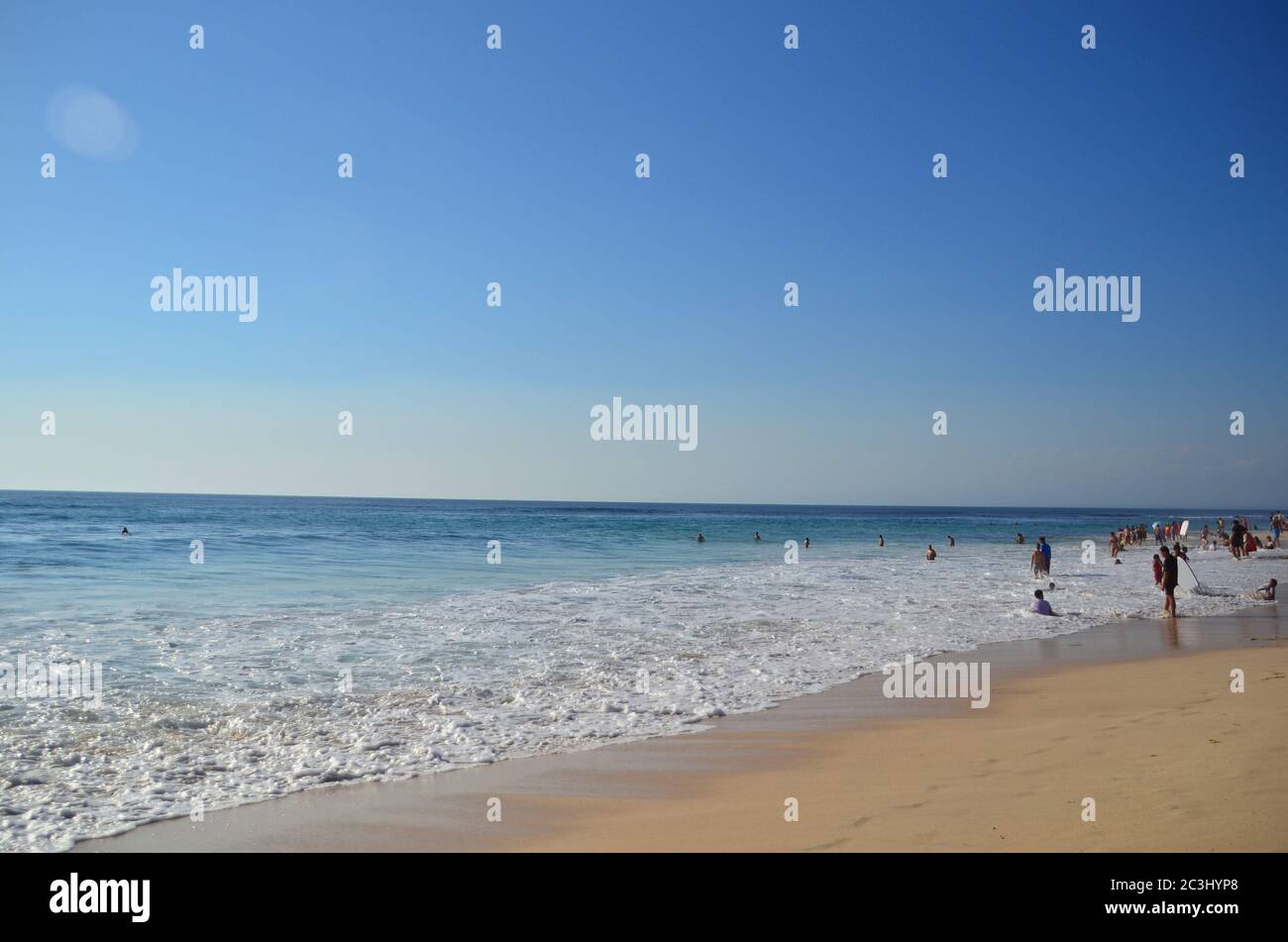 Sun reflection on the beach. Geger Beach is located in Sawangan, about ...