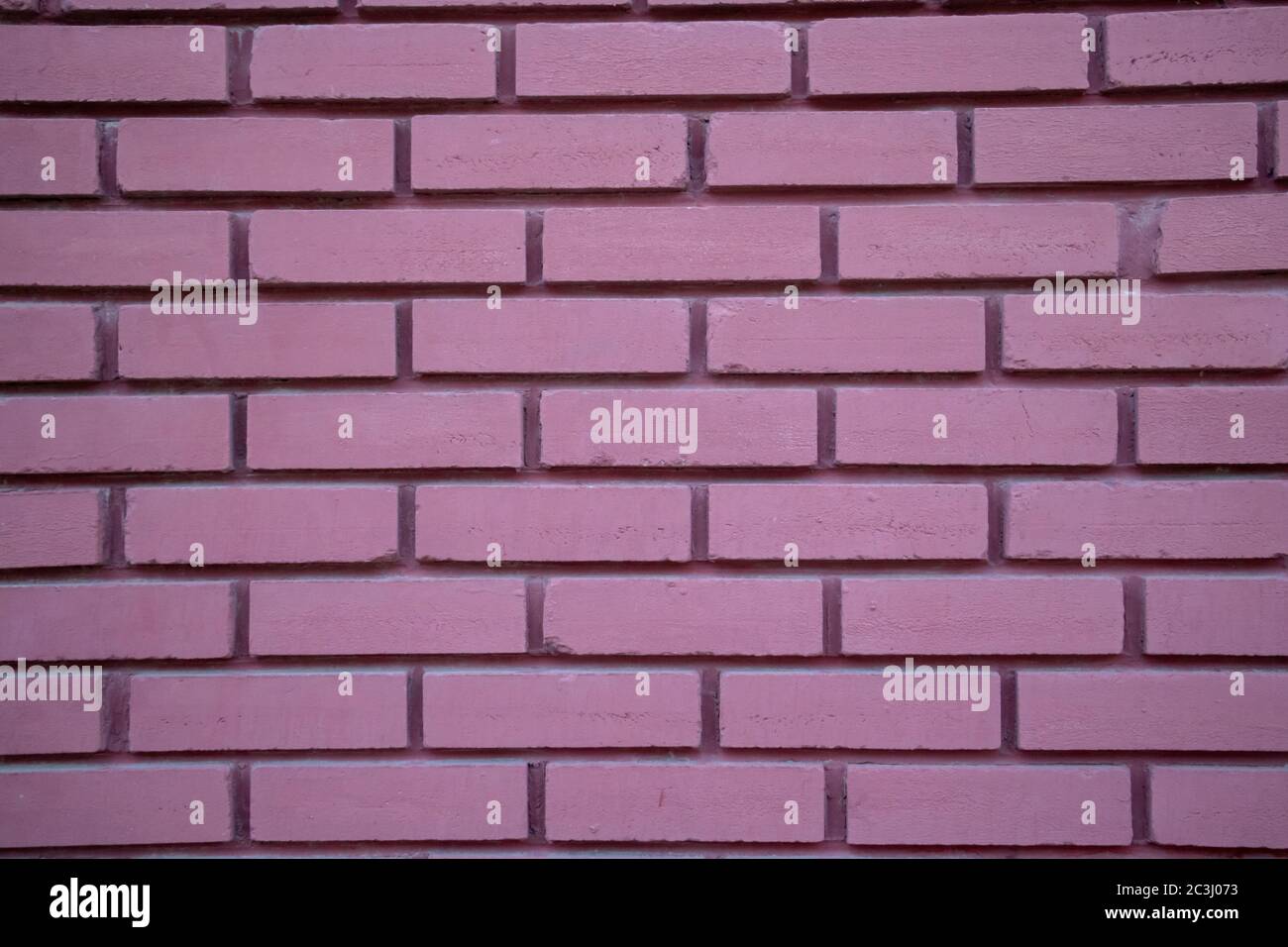 Vintage purple color brick wall background and texture, building facade ...