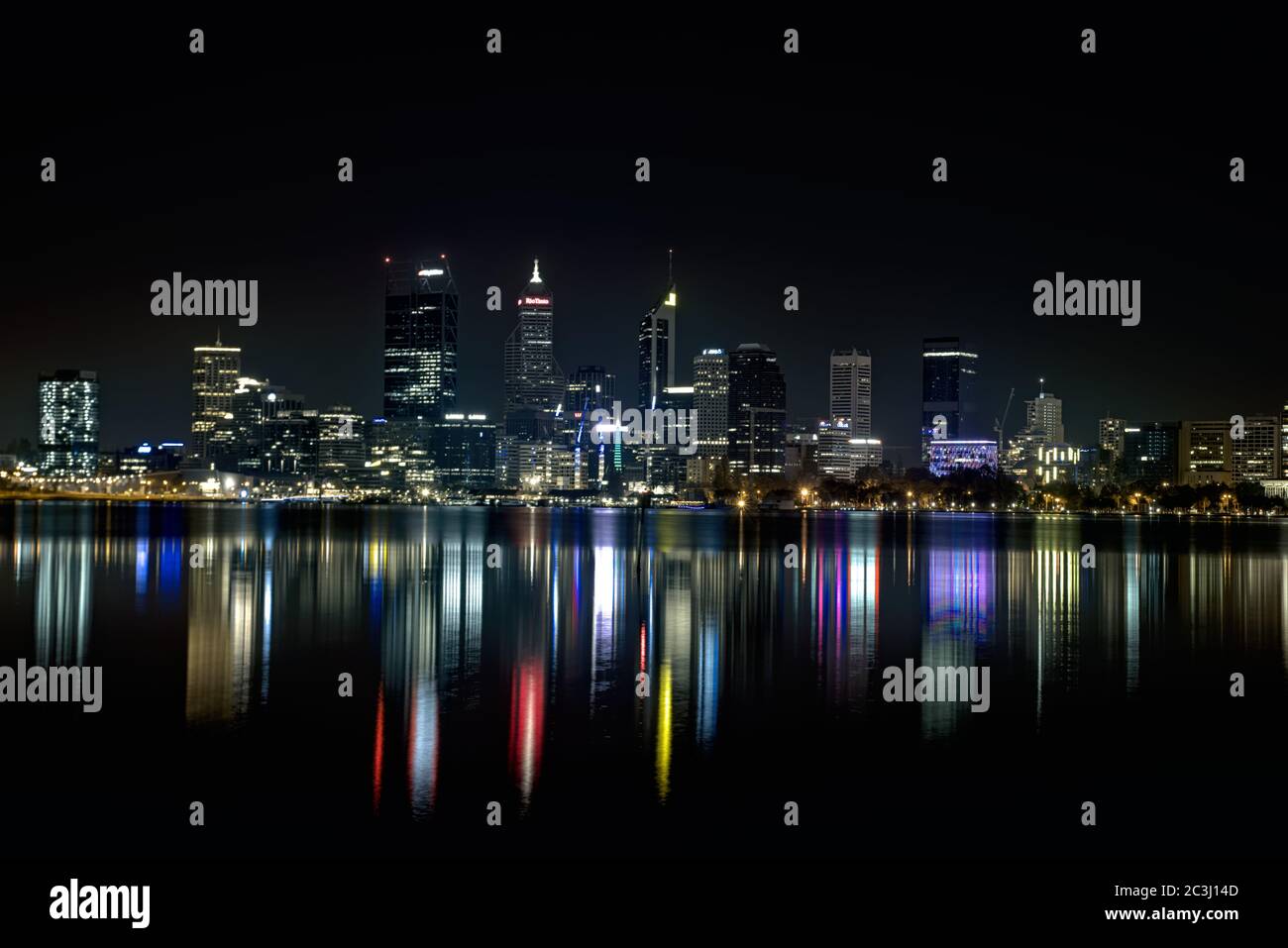 The Skyline of Perth at night. Reflecting in the svan river with a dark ...