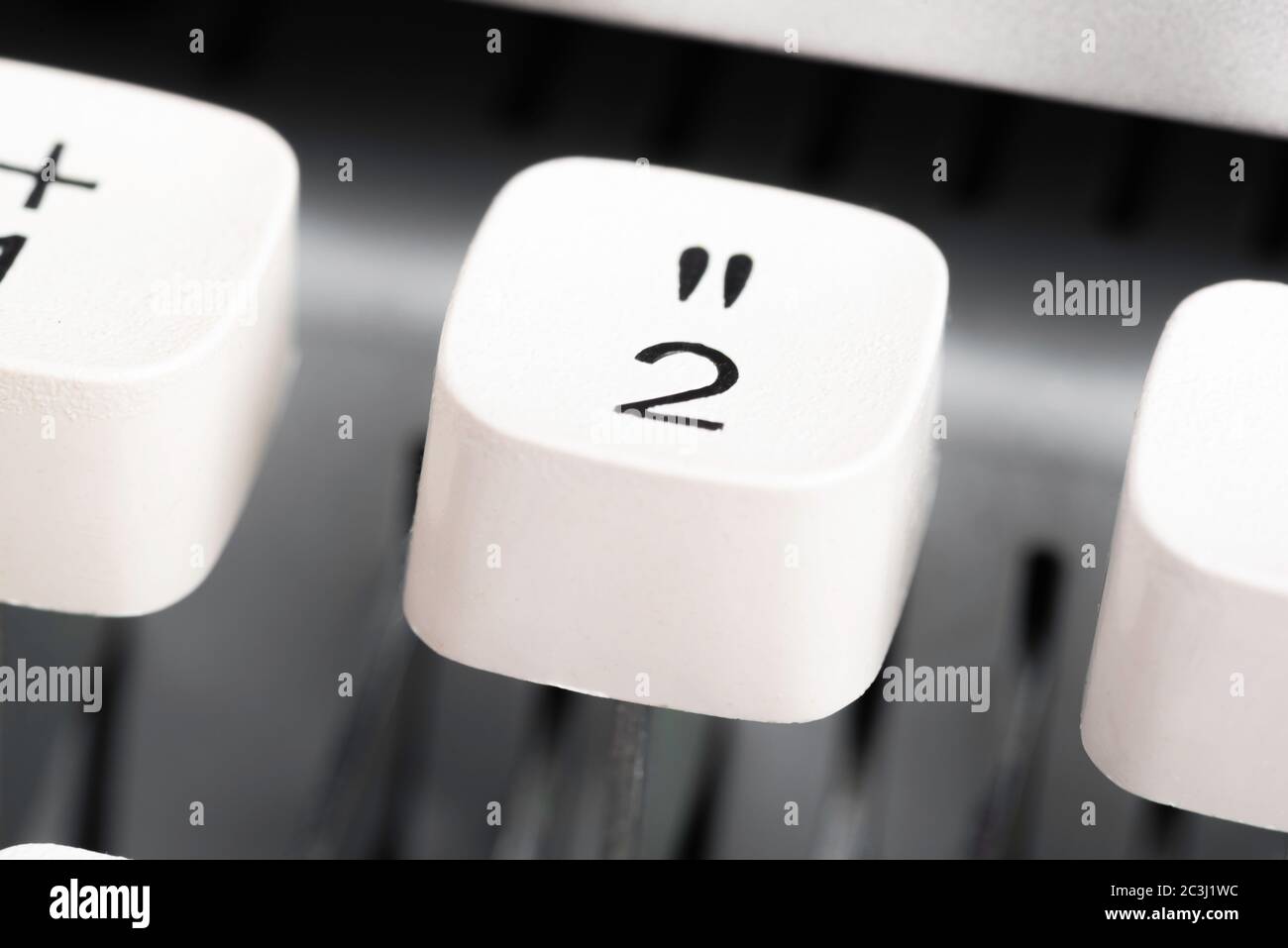 An extreme close-up or a macro shot of a plastic keyboard key from a ...