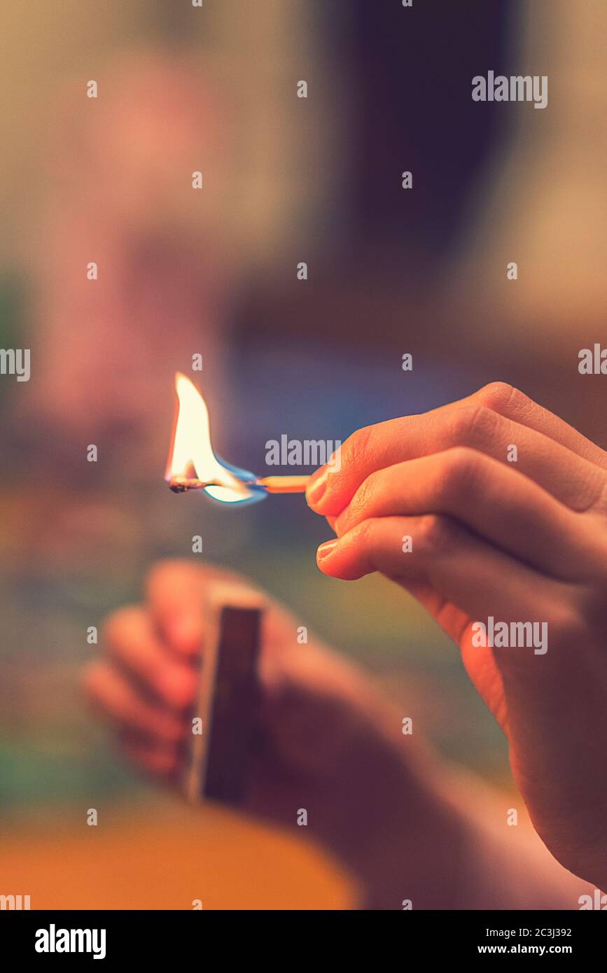 The child lighting the matches. The fire in the hands of a child ...