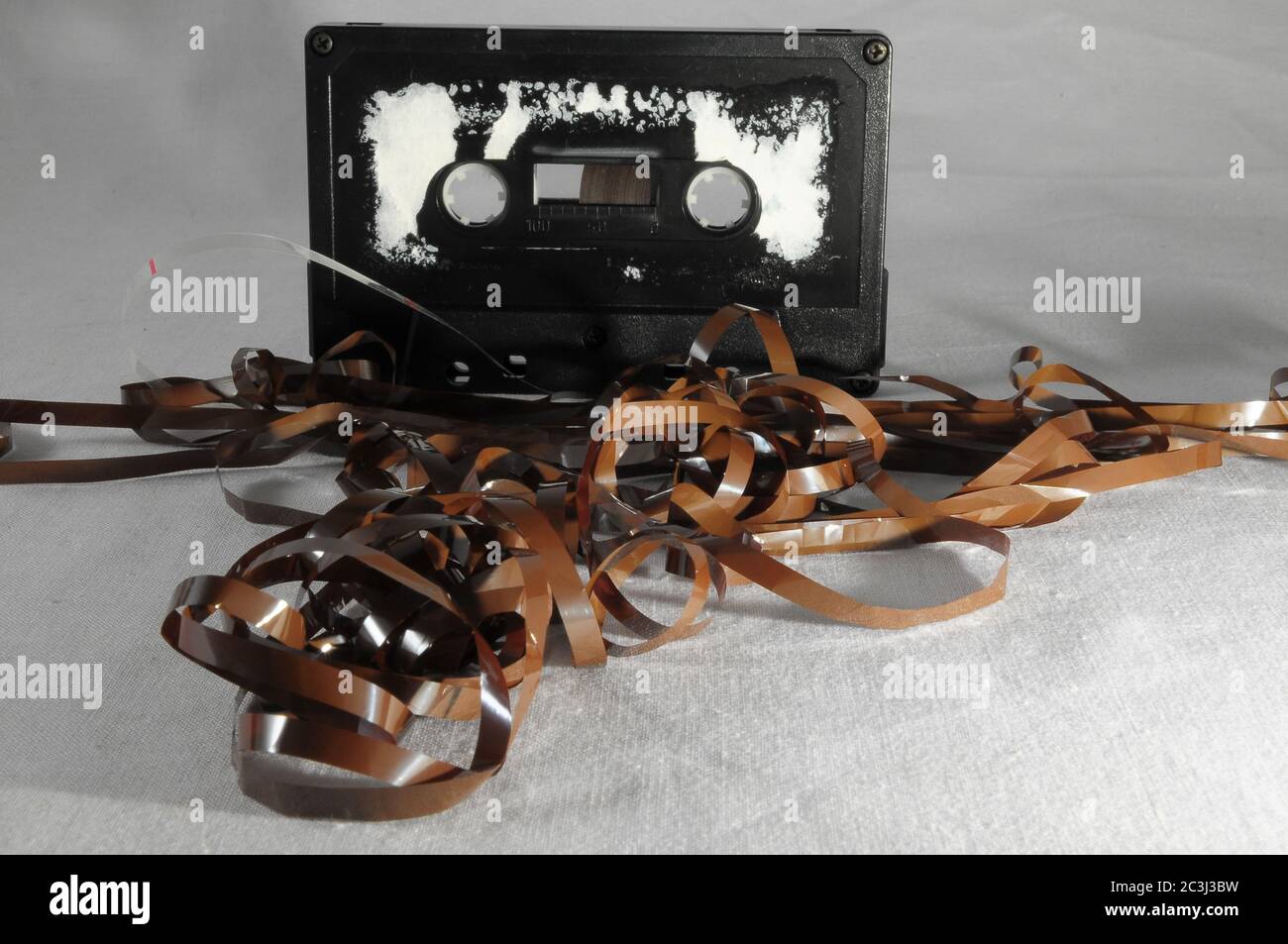 Ancient Vintage Used Musicassette over a White Background Stock Photo ...