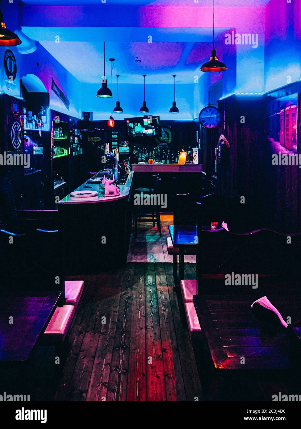 Vertical shot of an interior of a pub with blue and purple lights Stock ...