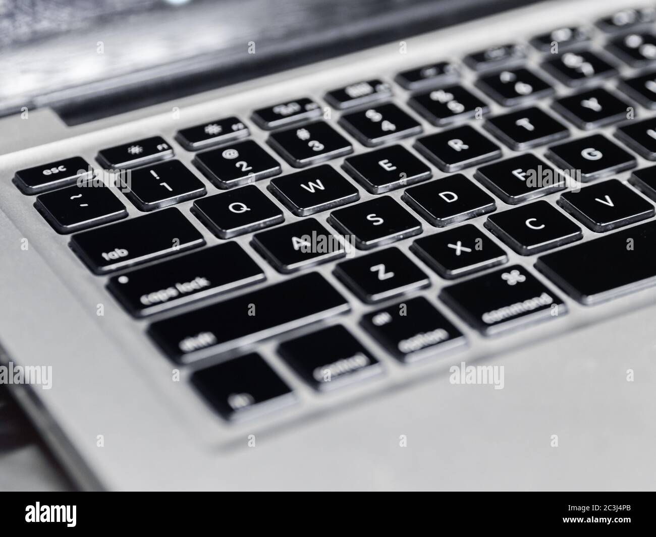 gray colored laptop focused on black keyboard Stock Photo - Alamy