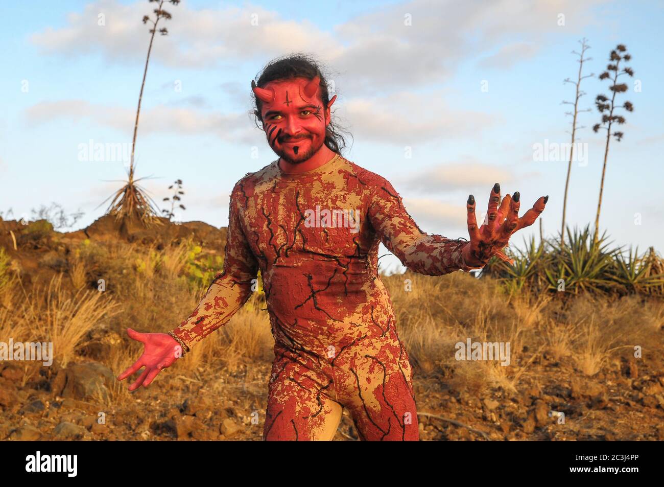 Latin American Man with Long Hairs Masked as a Devil in the Desert ...