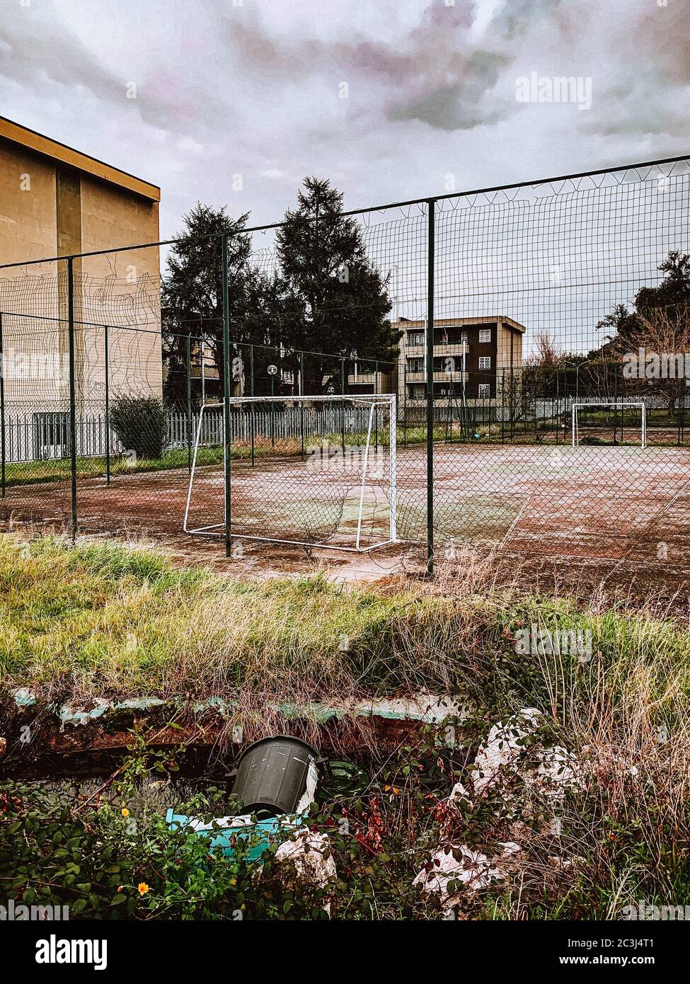 Vertical shot of a small football field wit iron fencings Stock Photo ...