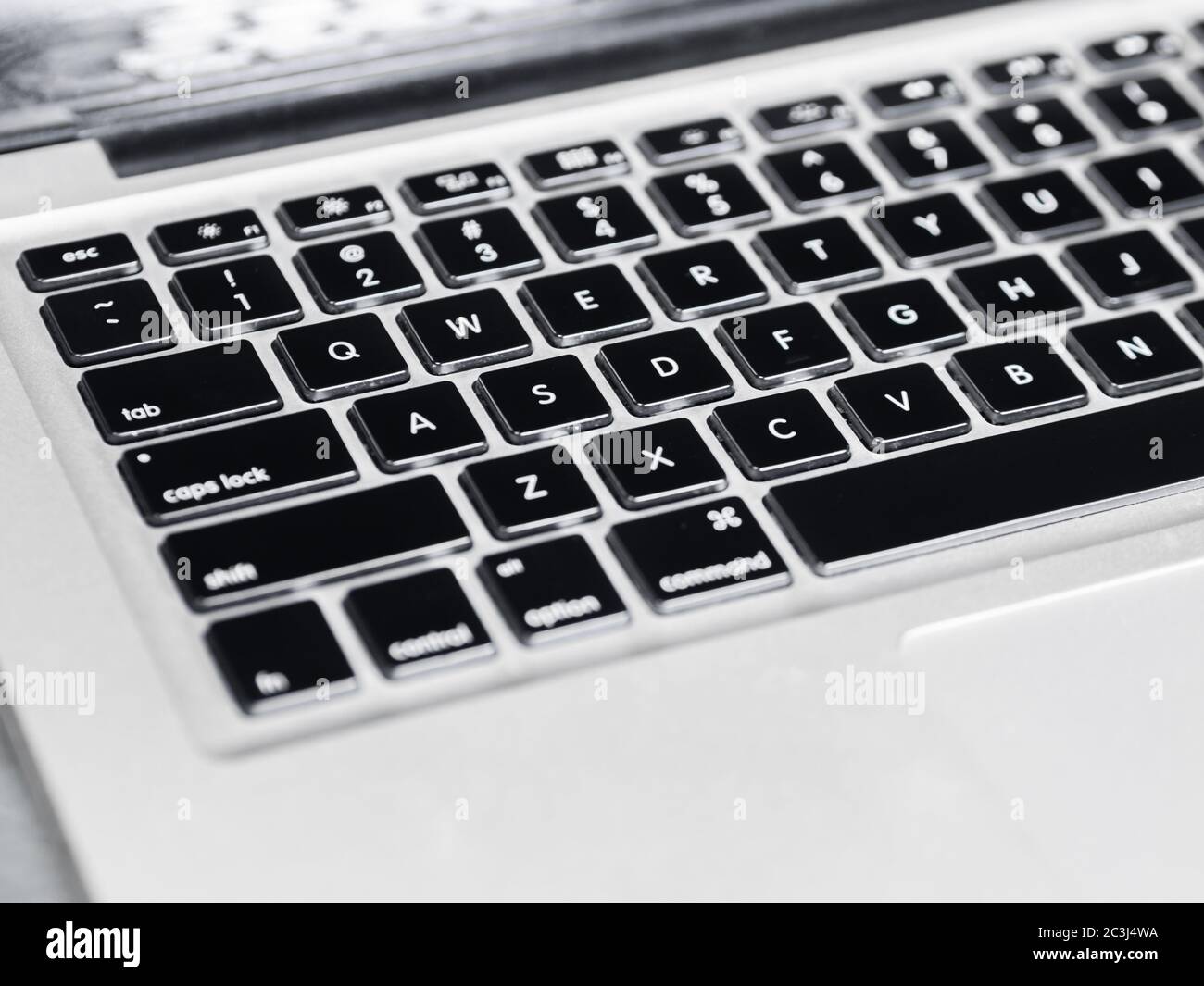 black qwerty keyboard of a gray laptop close-up Stock Photo - Alamy