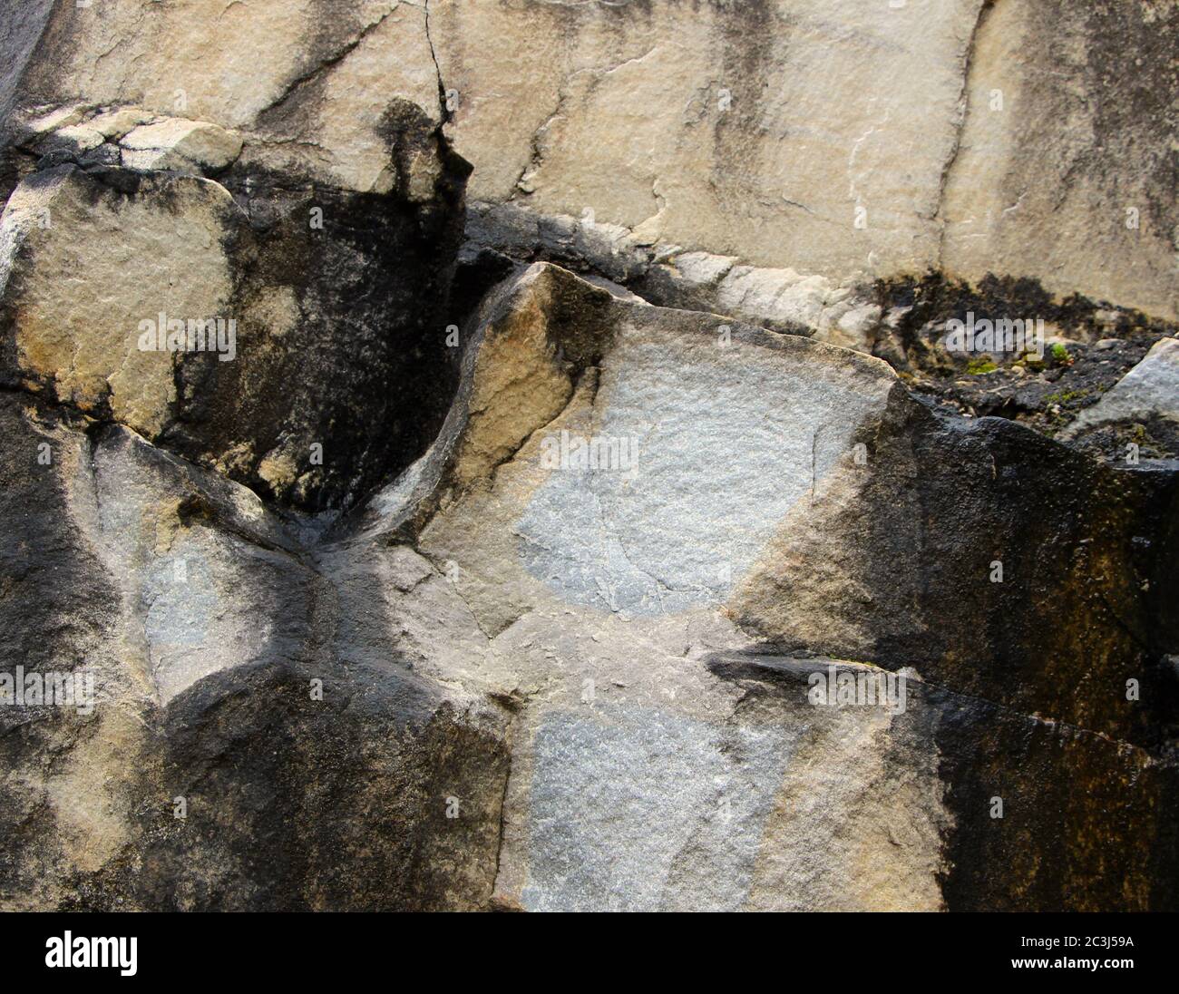 Close up of rock formation with seeping water causing discolouration ...