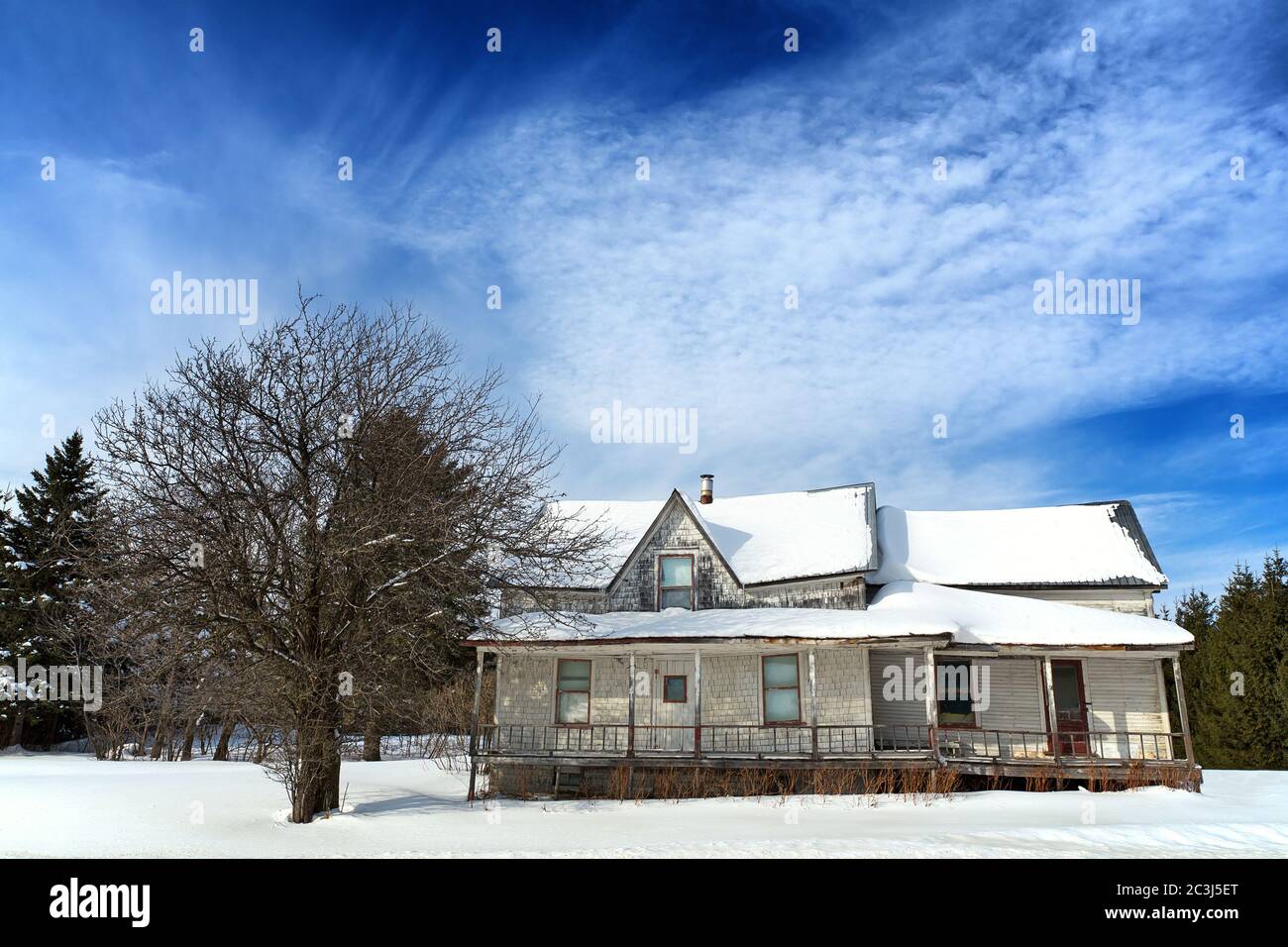 Snow covered rickety old house in the Beauce region of Quebec, Canada ...