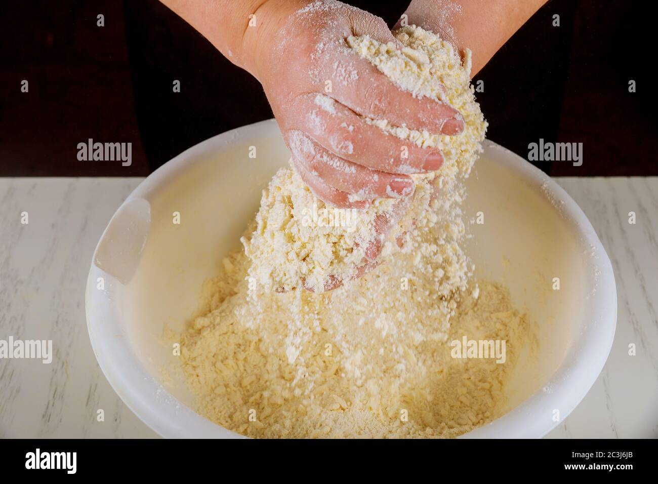 Woman mixing butter, sugar and flour with hands Stock Photo - Alamy