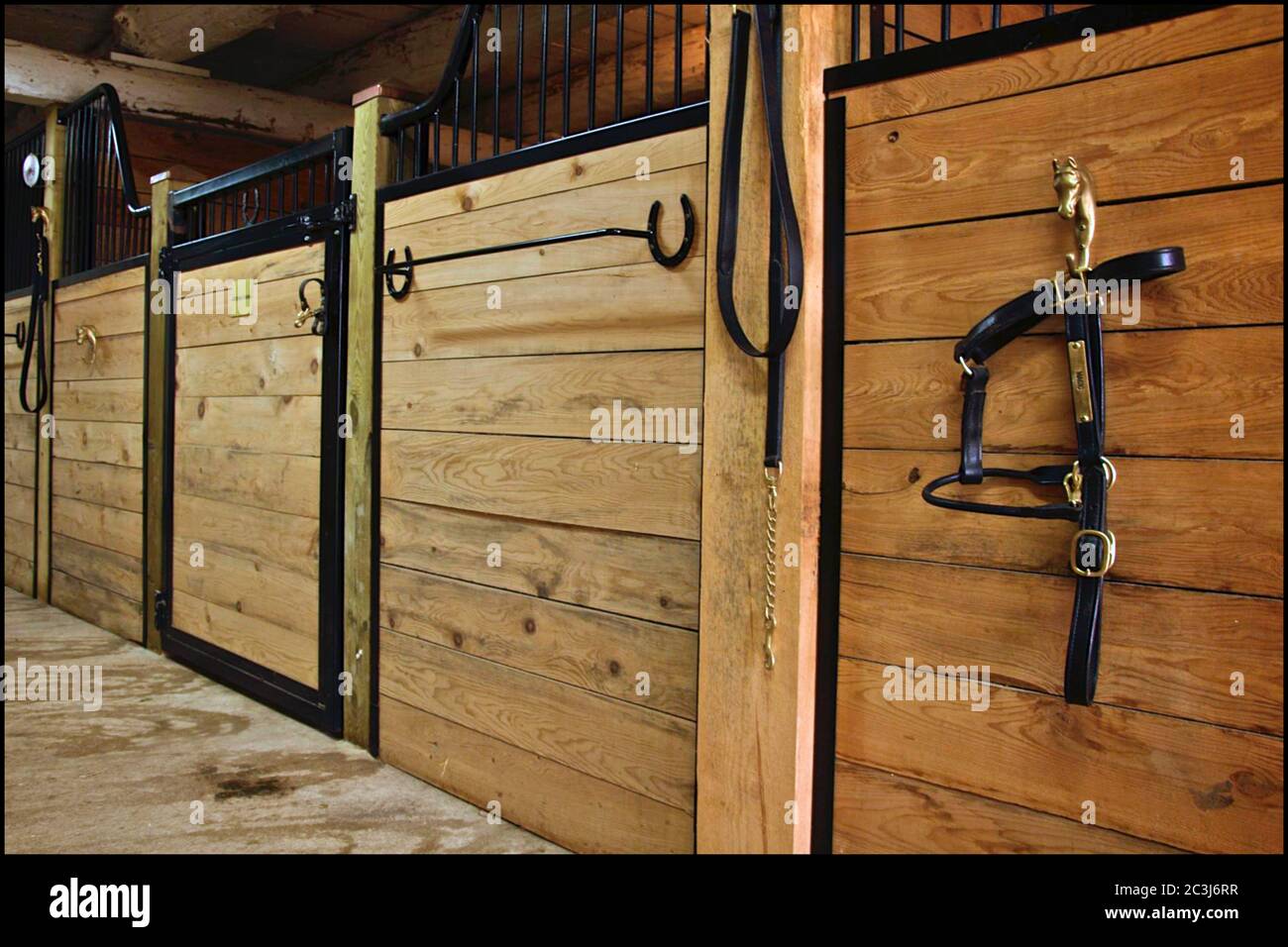 Horse farm stable shed interior with wood doors Stock Photo - Alamy