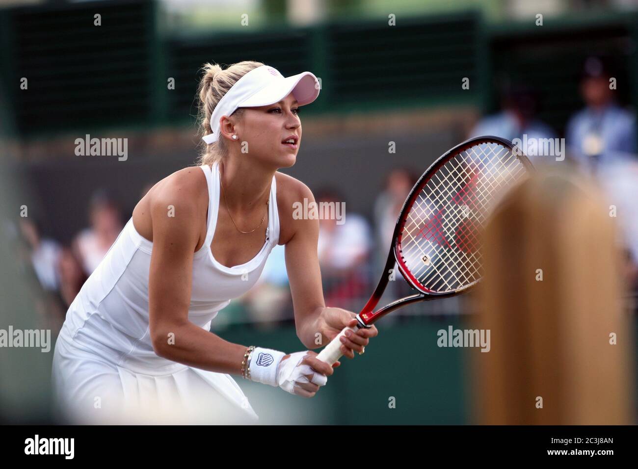 Anna Kournikouva awaits the start of the point during match against ...