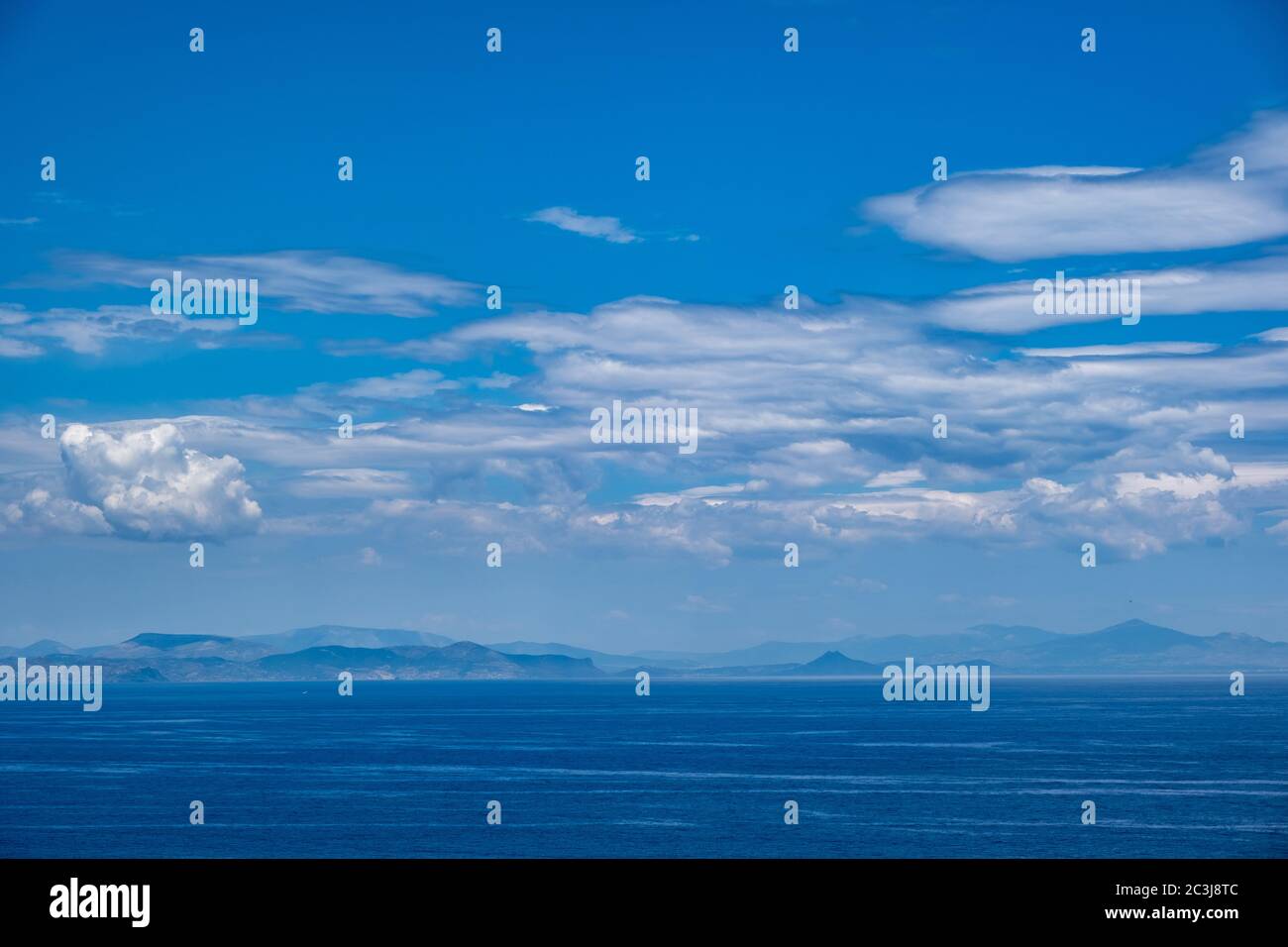 Blue sea and sky background, blue shades horizon. White clouds on clear ...