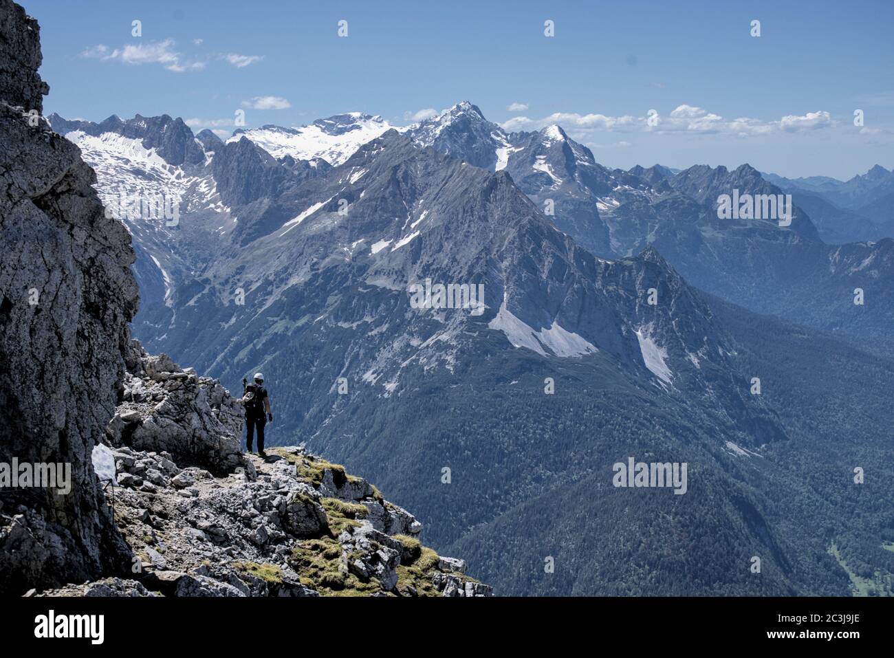 Hiker at the start of the Mittenwalder Höhenweg (via ferrata), admiring ...
