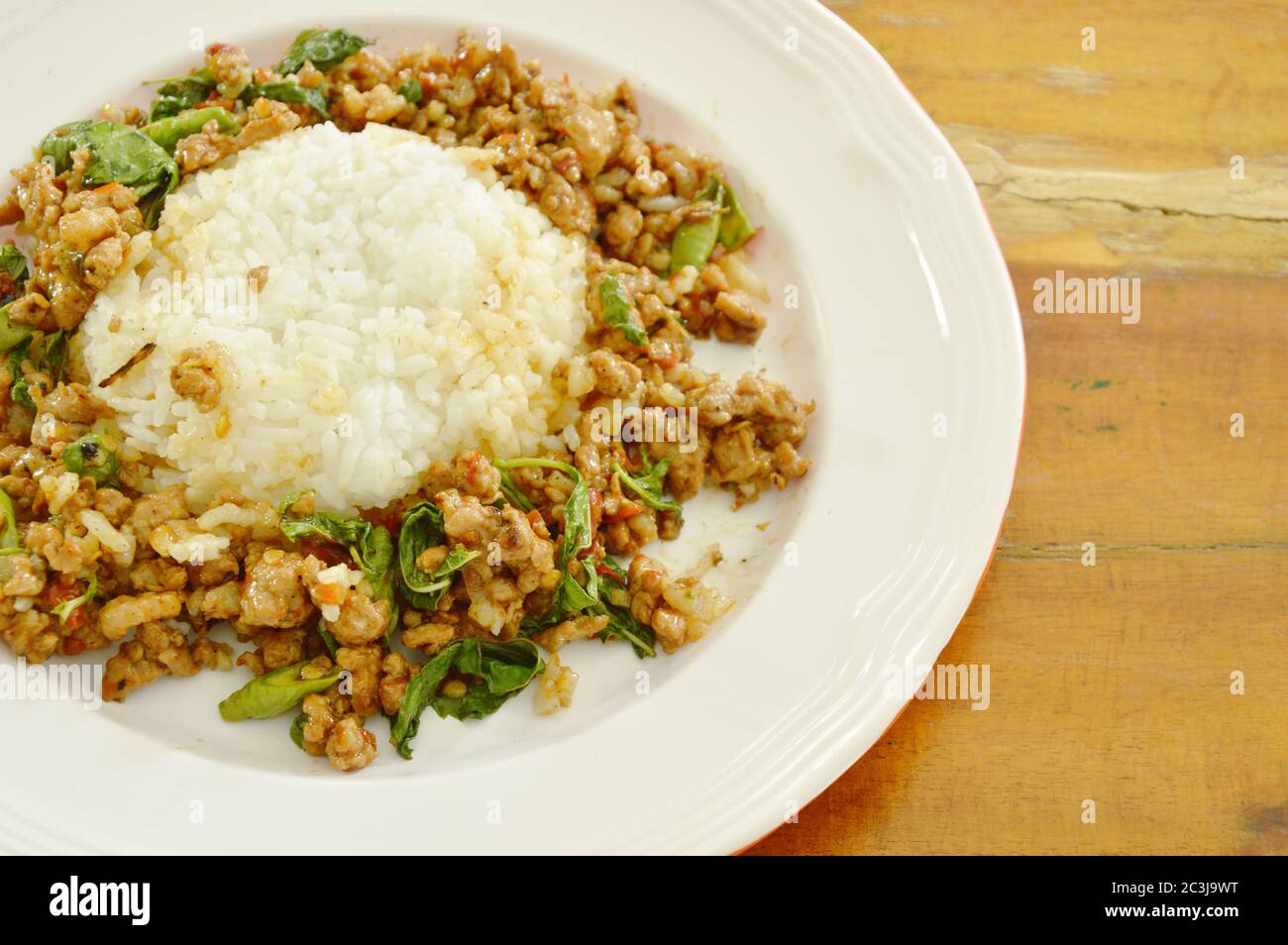 spicy fried minced pork with basil leaf on rice Stock Photo - Alamy