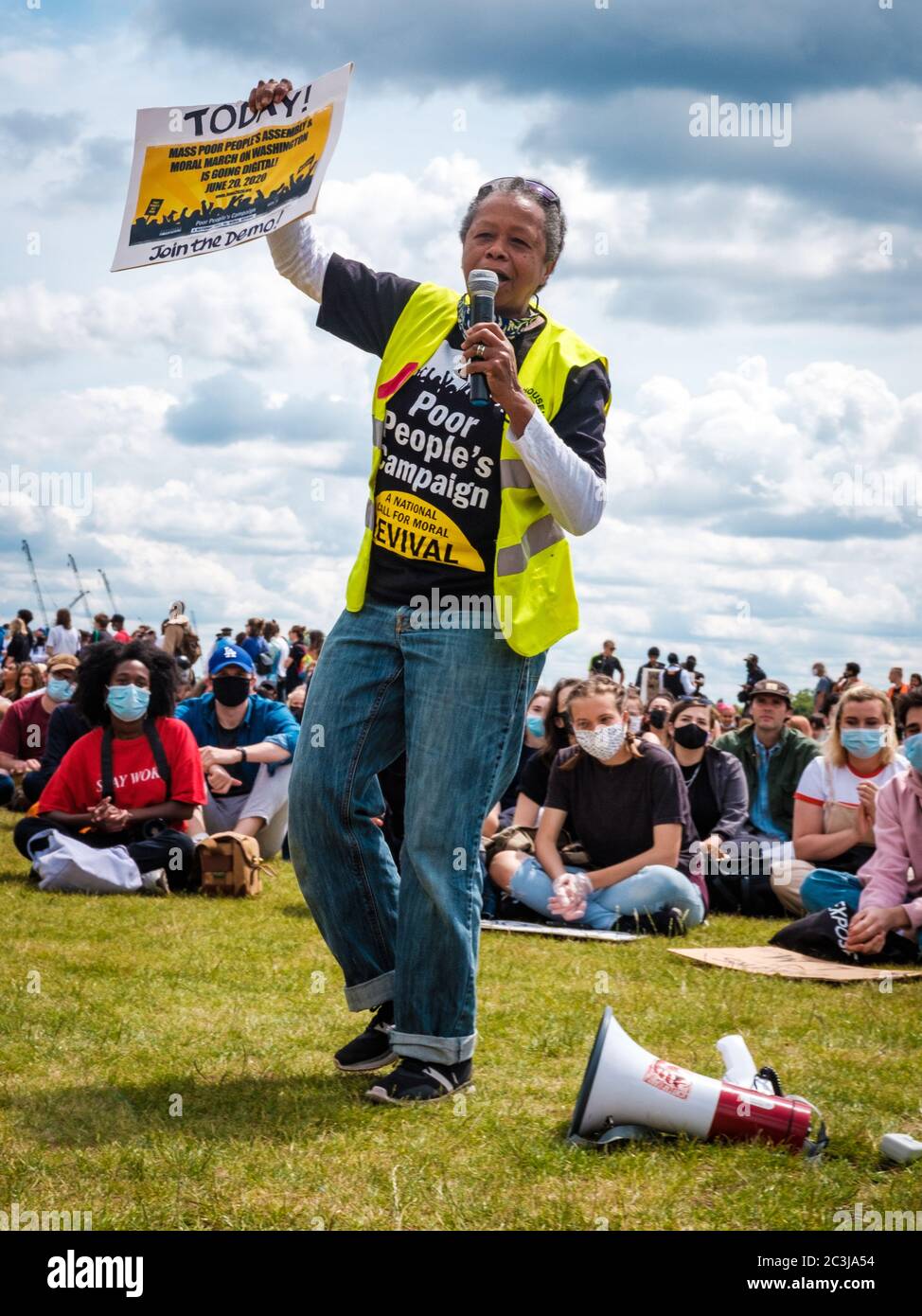 London, UK. 20th June, 2020. A speaker address the crowd at a peaceful ...