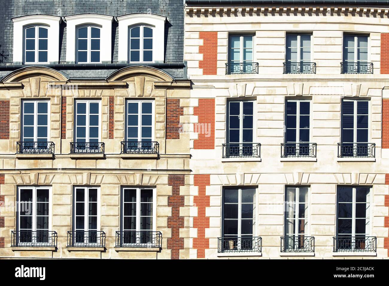 Typical Parisian architectural. The facade of a red brick building in ...