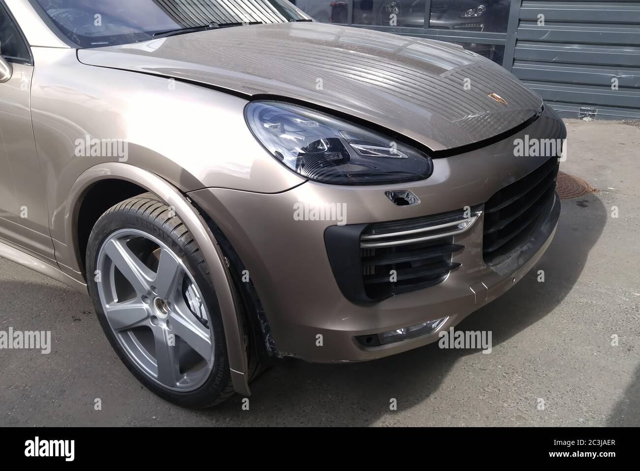 Moscow. February 2019. Accident Porsche Cayenne Turbo in gold color ...