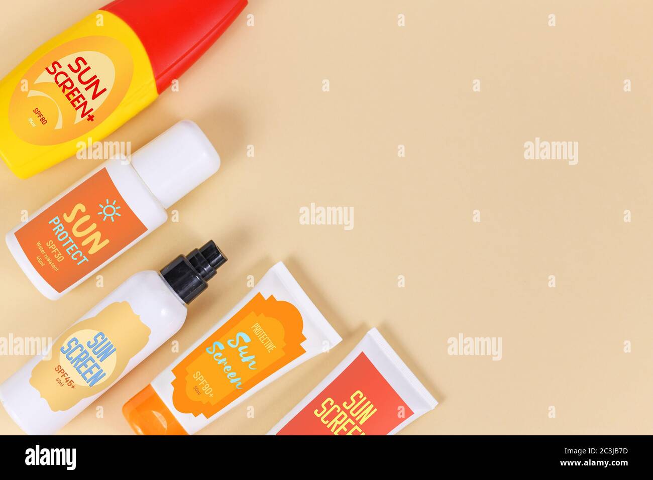 Various protective sun screen bottles and tubes with made up labels on ...