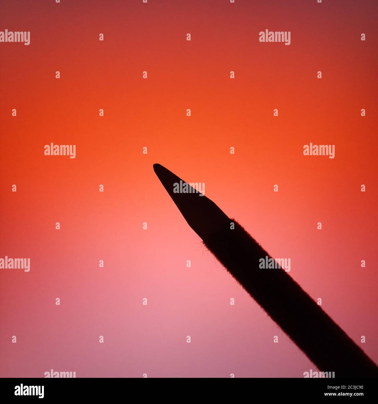 silhouette of pen,over background as orange color,black Stock Photo - Alamy