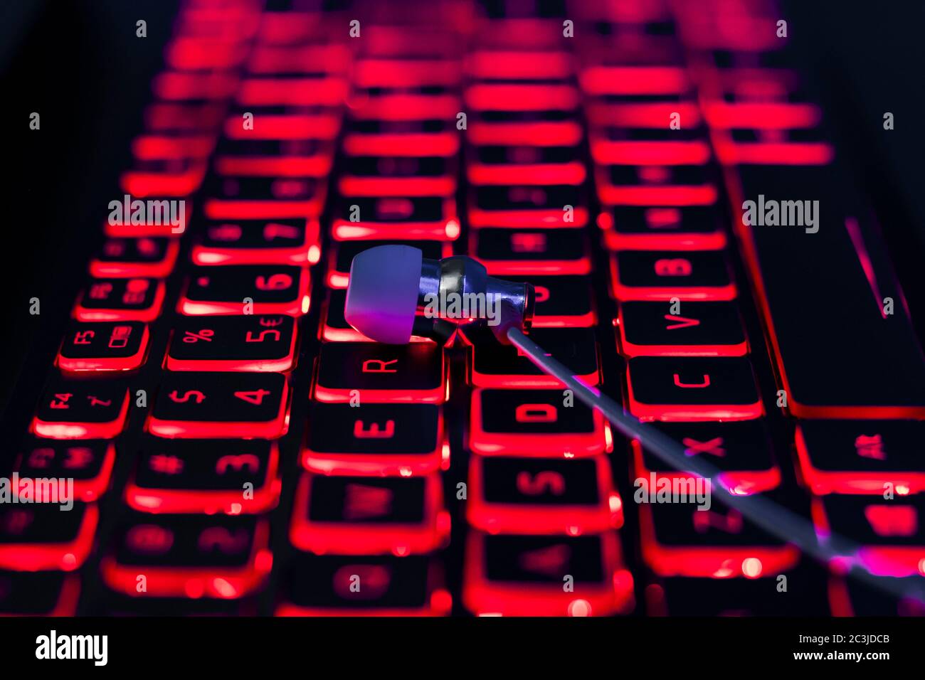 Backlit red keyboard in dark Stock Photo - Alamy