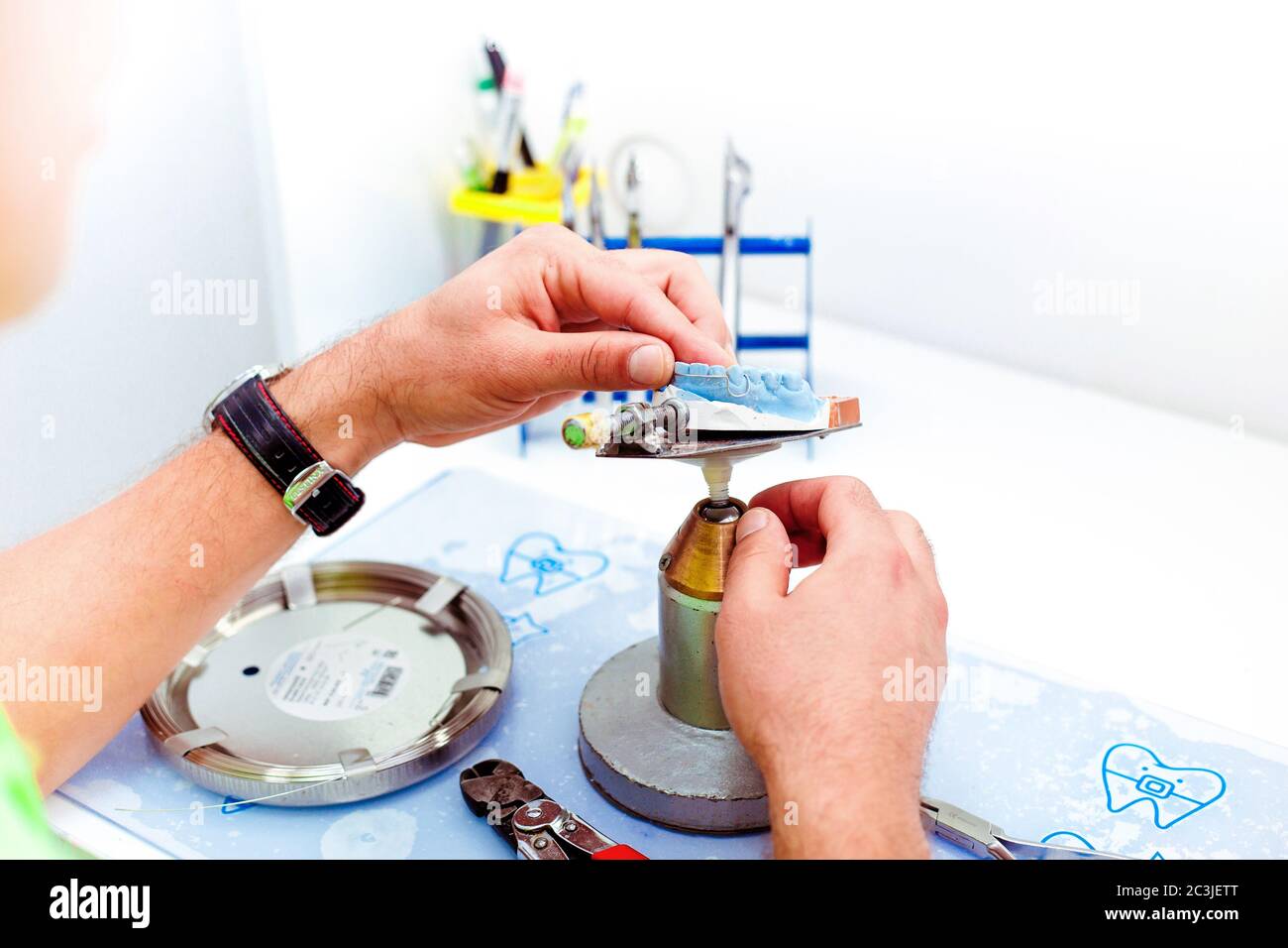 Dentist making teeth implants with special tools Stock Photo - Alamy