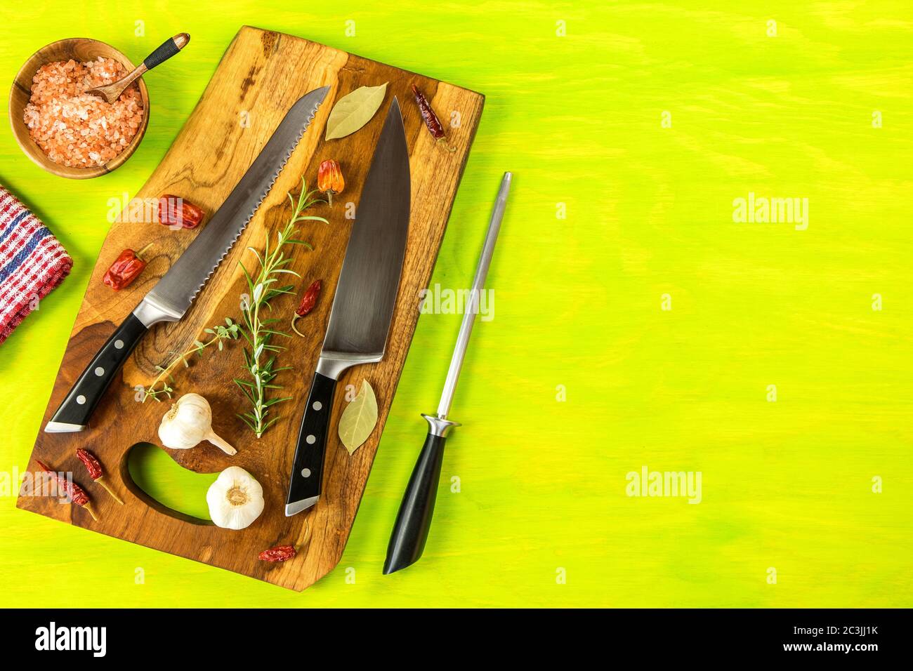 Big kitchen knife lying on an wooden cutting board. Kitchen utensils ...