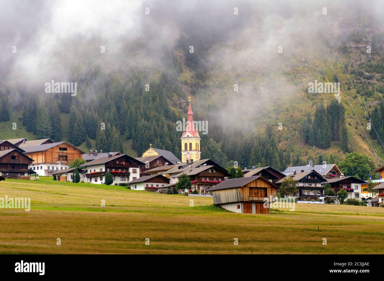 mist above the village of Obertilliach at Eastern Tirol, Austria Stock ...