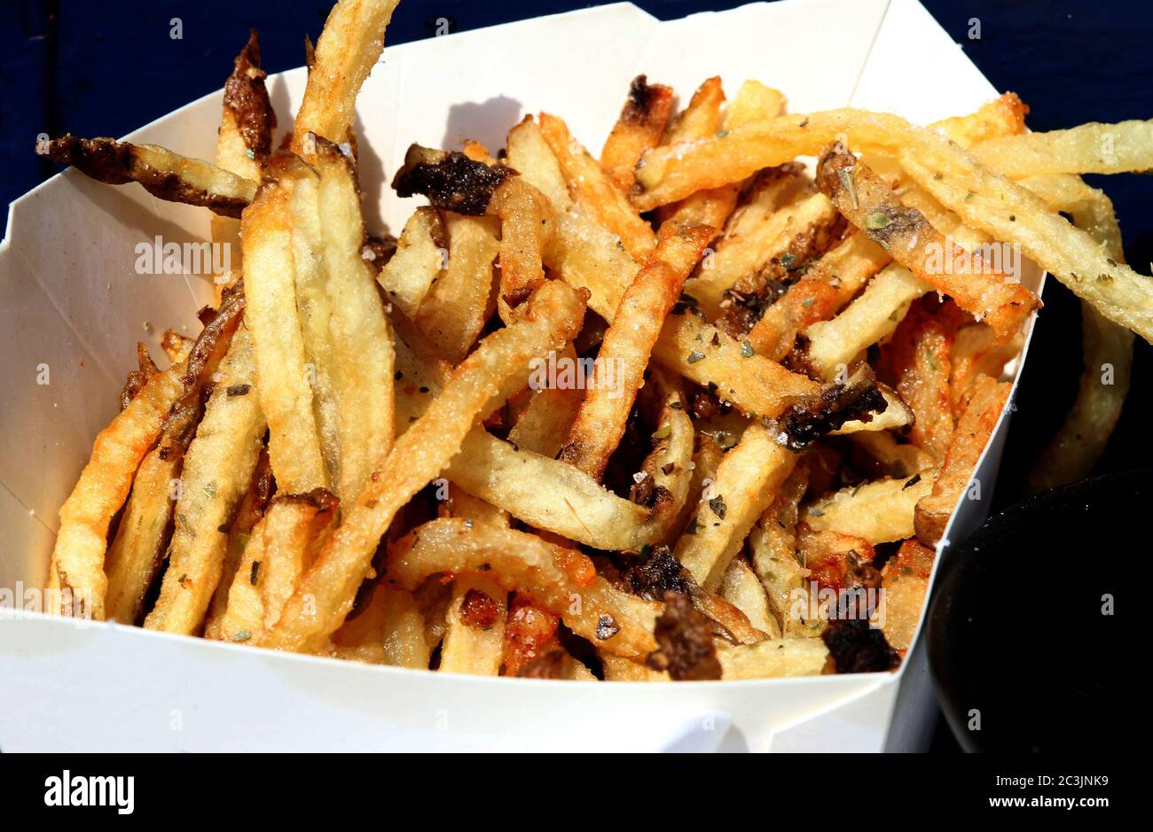 A pile of french fries at a street fair Stock Photo - Alamy