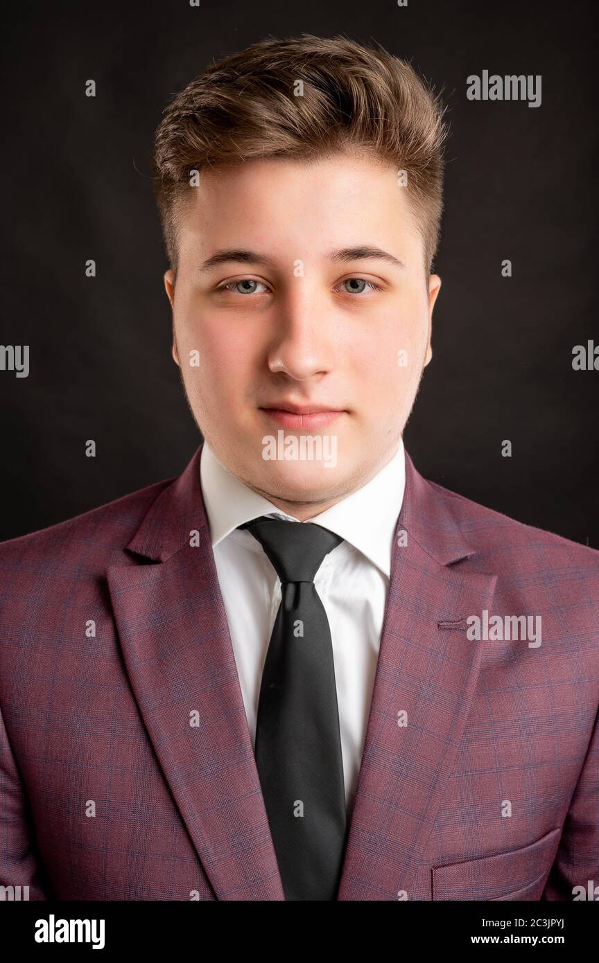 Portrait of law student with blond hair dressed in burgundy jacket ...