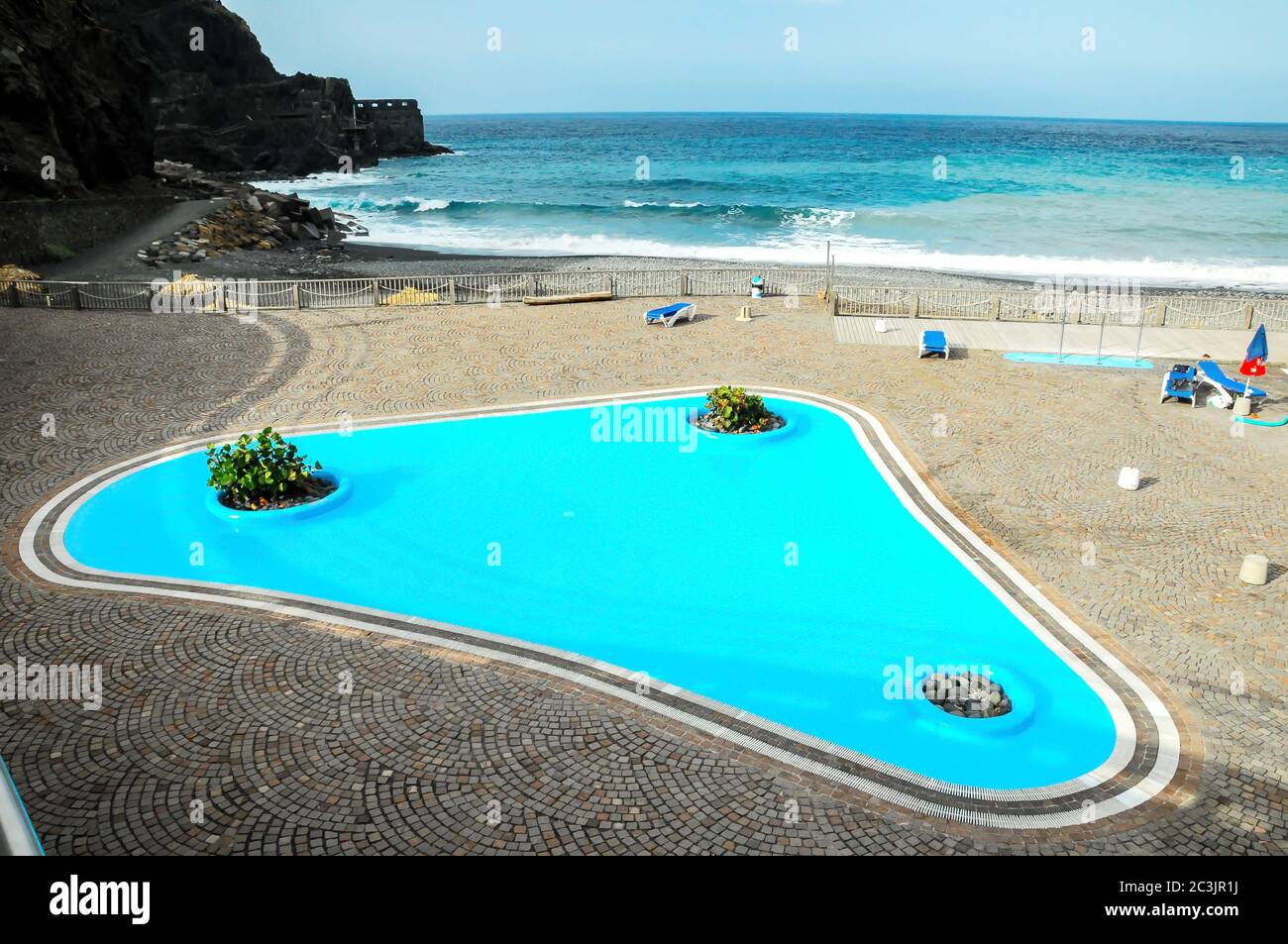 Blue Swimming Pool near the Atlantic Ocean Stock Photo - Alamy