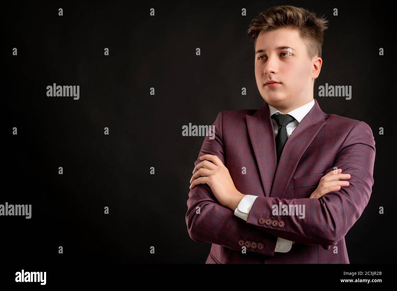 Law student with blond hair dressed in burgundy jacket, white shirt and ...