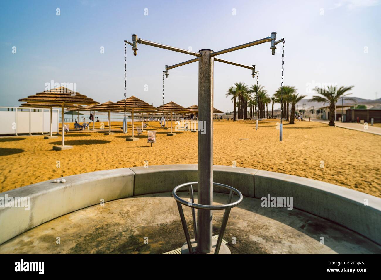 Shower for washing off salt and sand from the body on dead sea beach ...