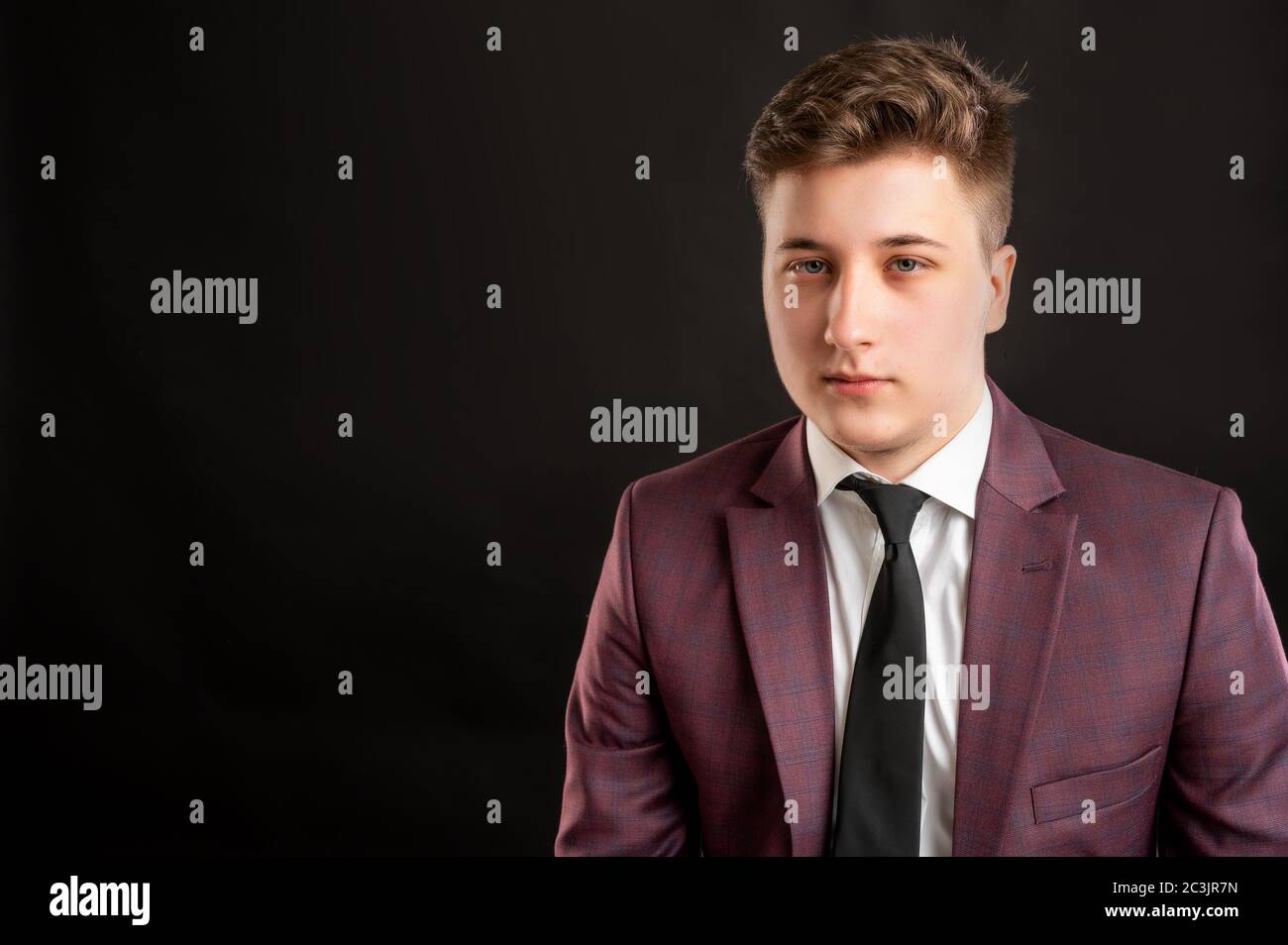 Close up portrait of law student with blond hair dressed in burgundy ...